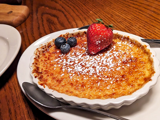 Cr&egrave;me br&ucirc;l&eacute;e with that crackling sugar top that makes the most satisfying "tap-tap" sound. The berries aren't just garnish; they're little flavor bombs.