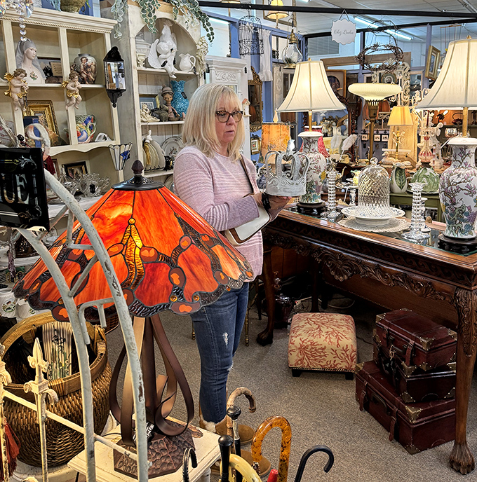 The thrill of the hunt captured in action. Shoppers navigate this wonderland of vintage treasures like archaeologists on the brink of discovery.