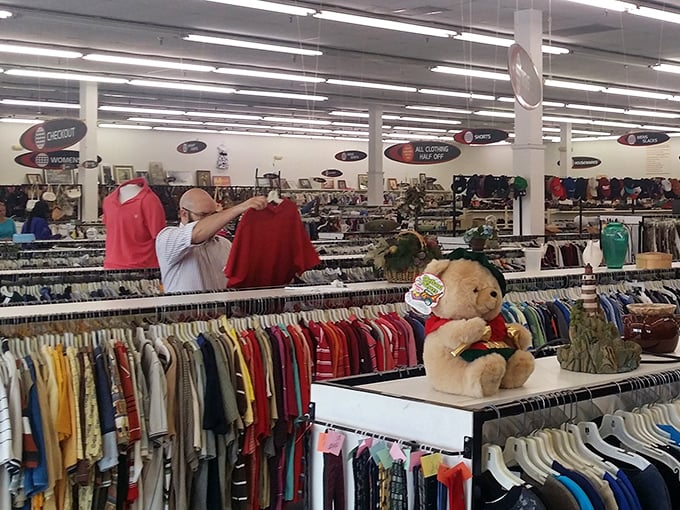 Treasure hunters in their natural habitat, scanning racks with the focus of archaeologists on the verge of discovering retail gold.