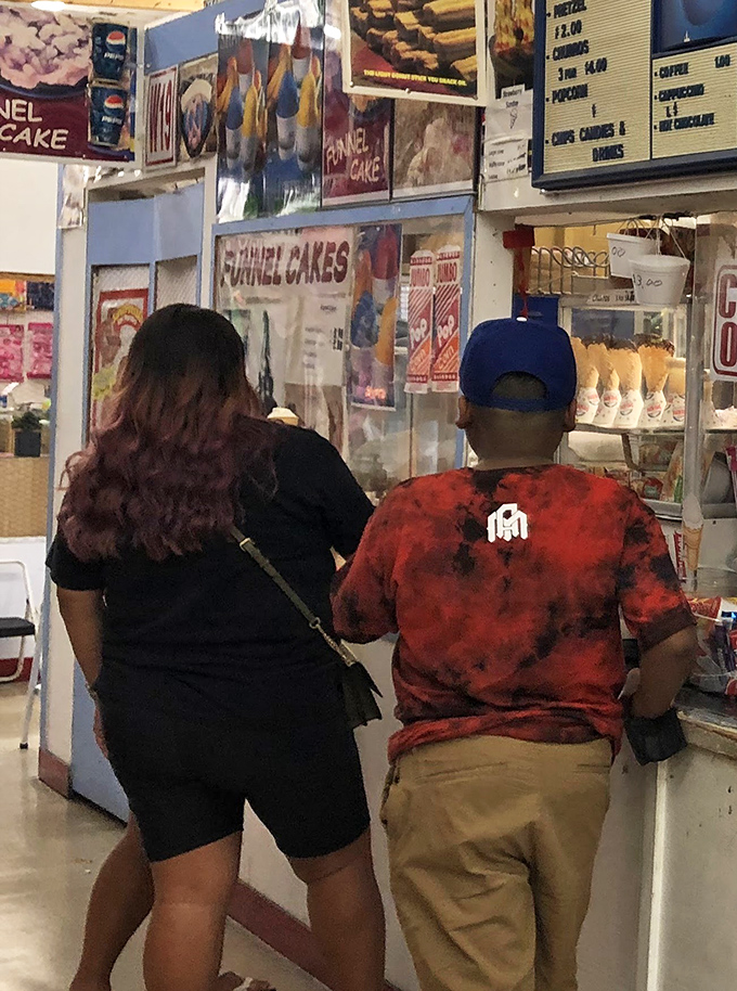 The universal language of funnel cakes brings shoppers together. Nothing fuels serious bargain hunting like a sugar rush.