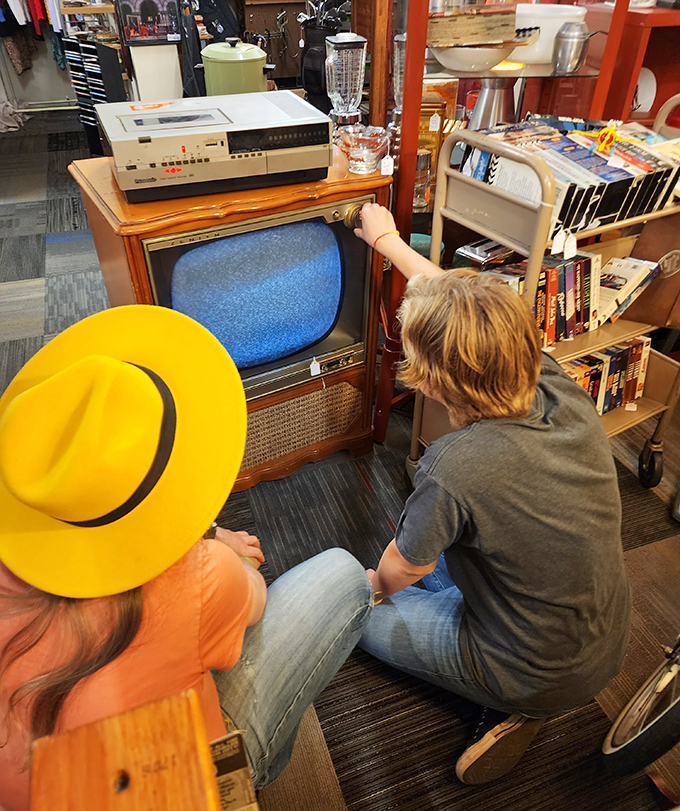 Vintage technology brings generations together as shoppers discover the charm of tube televisions and VCRs that once represented cutting-edge entertainment.