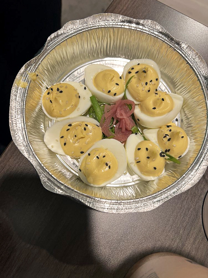Deviled eggs get a glow-up with black sesame seeds and pickled garnish. Grandma's picnic classic just got its PhD in deliciousness.