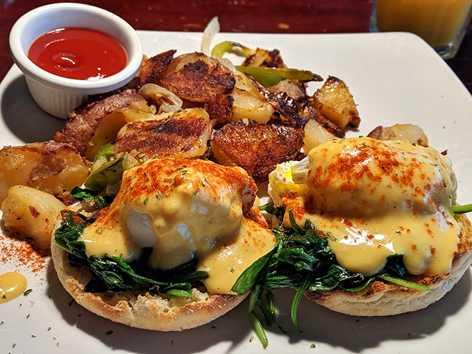 Eggs Benedict that would make a brunch enthusiast weep with joy. Those potatoes look like they've been kissed by butter and herbs.