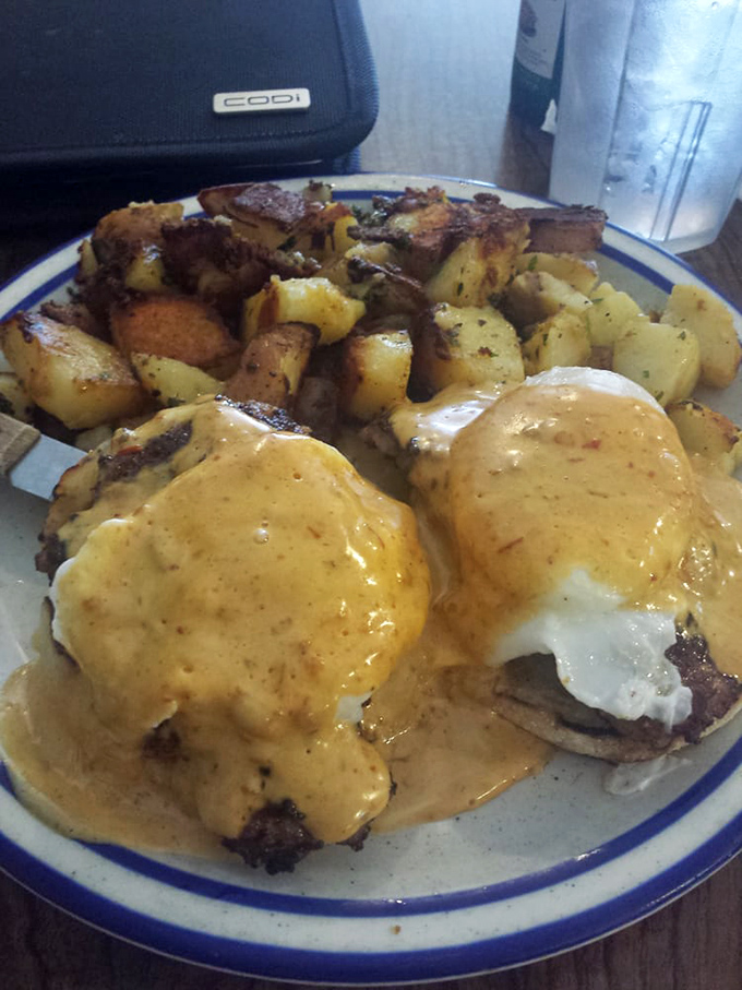 Eggs Benedict with hollandaise so golden it would make King Midas jealous. Whoever said "you can't buy happiness" never saw this plate arrive at their table.
