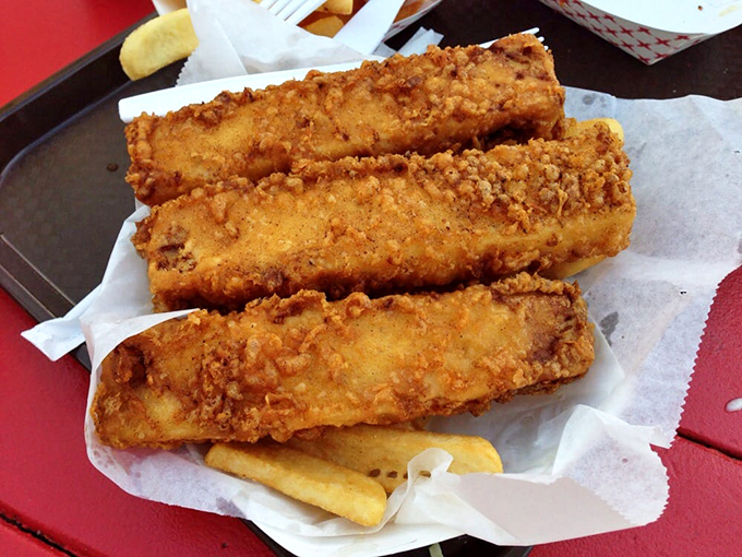 Golden-battered fish that shatters at first bite, revealing steamy, delicate flesh within&mdash;proof that simplicity, when done right, is culinary genius.