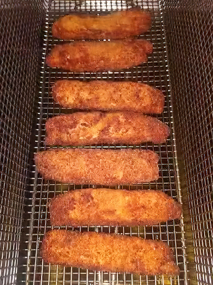 Golden treasures fresh from the fryer &ndash; these fish fillets aren't just cooked, they're transformed into crunchy-on-the-outside, tender-on-the-inside masterpieces.