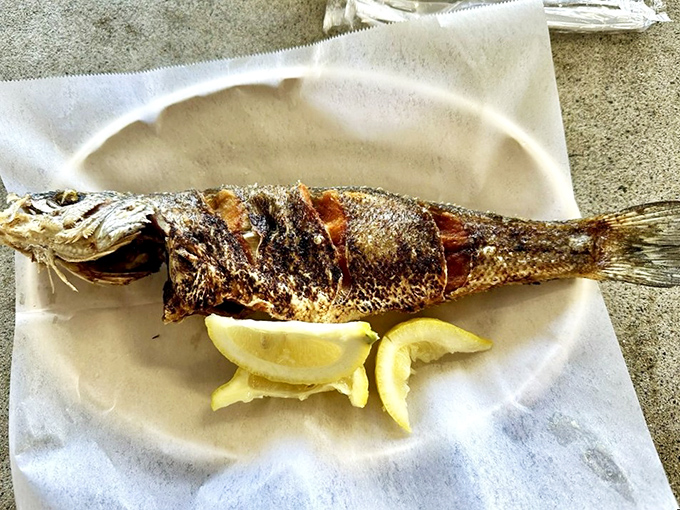 When a whole fish arrives looking this perfectly charred, you know you're in for a meal that respects both the catch and the diner.