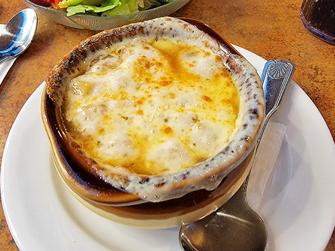 Behold the French onion soup that's causing all the fuss &ndash; bubbling cheese perfection in every spoonful.