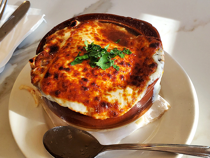 This isn't just French onion soup &ndash; it's a bubbling masterpiece that redefines comfort in a crock.