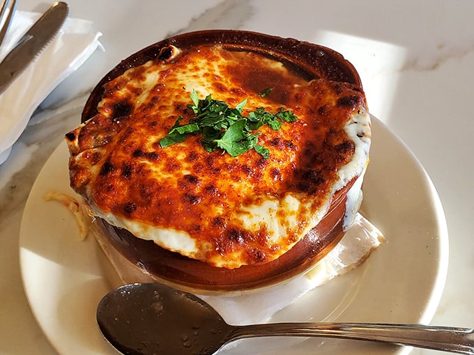 This isn't just French onion soup &ndash; it's a bubbling masterpiece that redefines comfort in a crock.