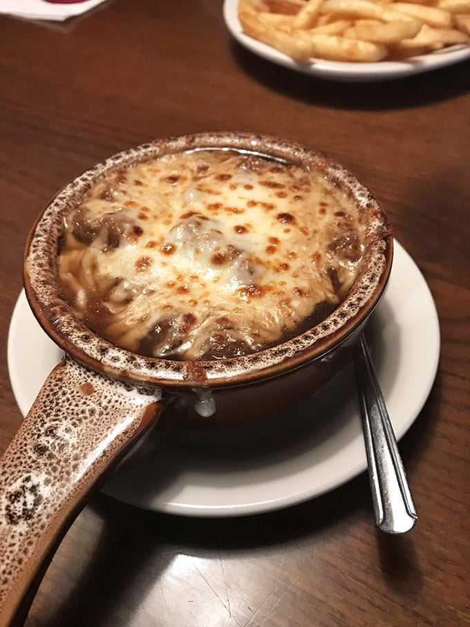 French onion soup done right: bubbling cheese, rich broth, and pure comfort in a bowl.