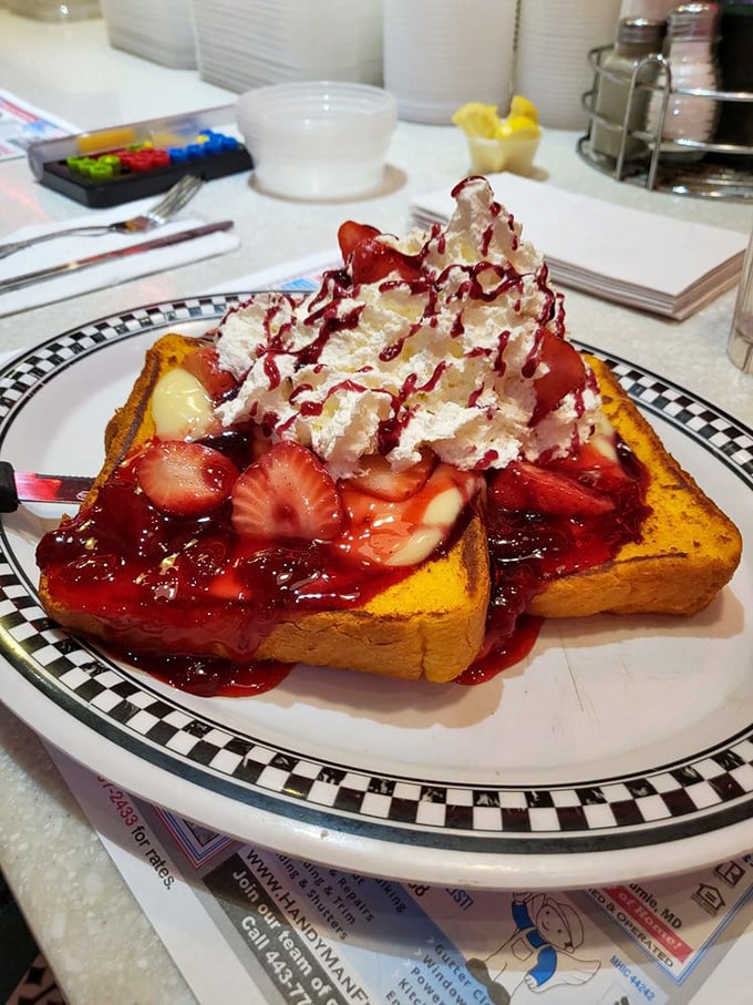 The strawberry French toast doesn't just feed you &ndash; it hugs your soul. That mountain of whipped cream and berry sauce is basically therapy on a plate.