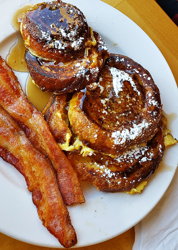 French toast that's had an existential crisis and decided to become dessert instead. Those crispy edges are where dreams live. 