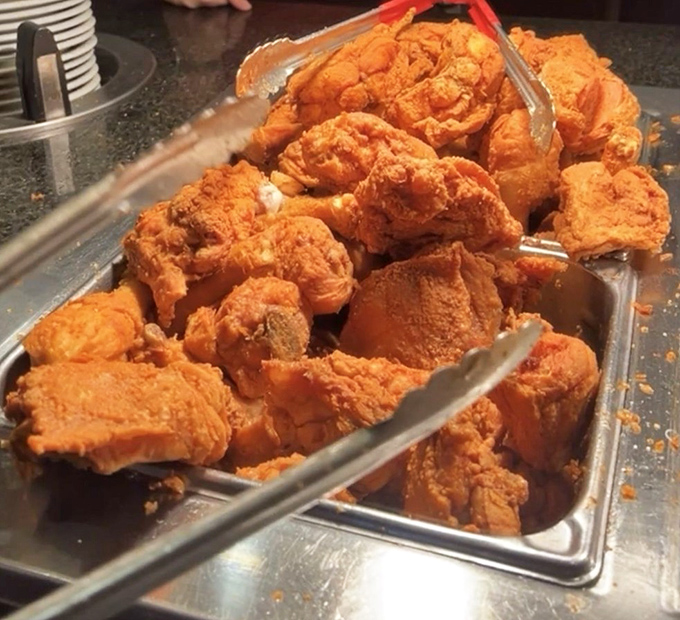 Golden fried chicken pieces that would make the Colonel himself weep tears of pure joy and professional envy.