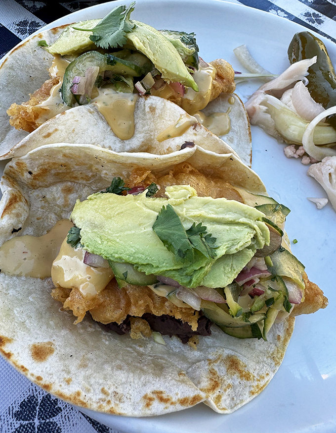 Fish tacos elevated to art form&mdash;crispy battered fish, creamy avocado, and tangy slaw create a harmony that makes your taste buds feel like they're attending the symphony.