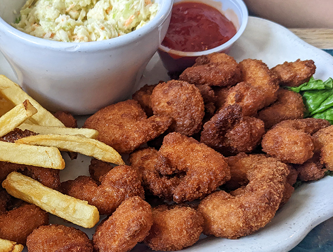 Golden-fried shrimp that crunch like autumn leaves, accompanied by the kind of coleslaw that makes you wonder why you'd ever eat anything else.