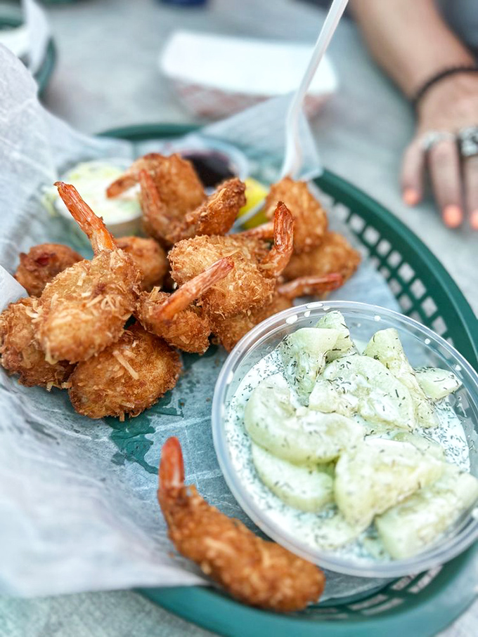 Golden-fried shrimp that snap between your teeth, paired with cucumber salad that provides the perfect cool counterpoint. Beach food nirvana achieved.