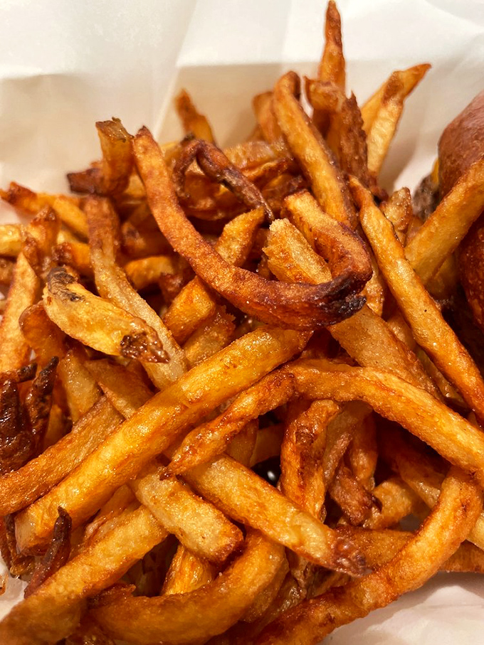 Behold the golden masterpiece that'll ruin you for all other fries – crispy perfection in every strand.