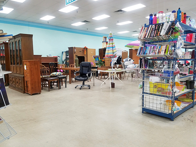 Furniture that tells stories sits patiently waiting for its next chapter. That china cabinet has probably seen more family dinners than most restaurants.