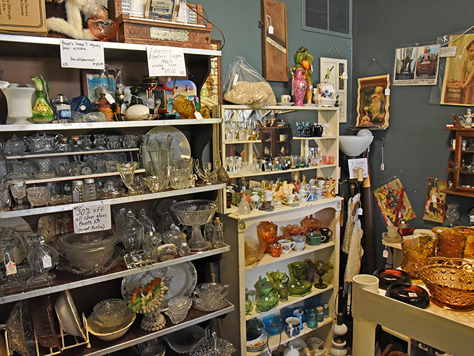 The glass collection sparkles like a kaleidoscope of history. Depression glass mingles with carnival glass in this colorful conversation starter.