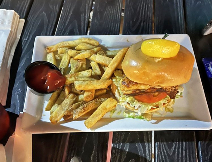 The star of the show: a perfectly golden grouper sandwich that makes you understand why people drive across the state for this beauty.