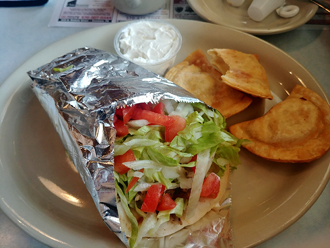 The humble gyro wrap proves diners aren't just breakfast specialists&mdash;this foil-wrapped flavor bomb comes with crispy chips and fresh veggies.