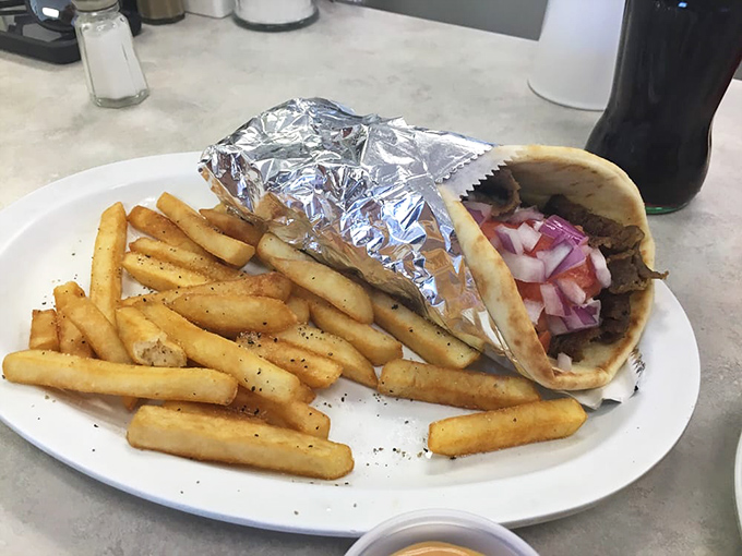 This gyro isn't trying to win a beauty pageant, but wrapped in foil like a present, it delivers Mediterranean flavors alongside golden fries.