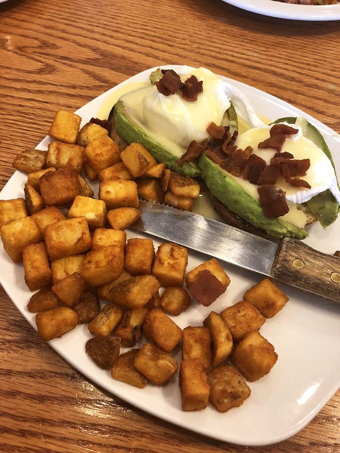 Whoever said "you can't have your avocado and eat it too" never experienced this Benedict masterpiece, where creamy meets crispy in a breakfast love story.