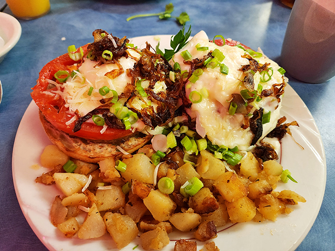 Eggs Benedict's sophisticated cousin has arrived, sporting crispy potatoes, perfectly poached eggs, and enough green onions to make your Instagram followers jealous.