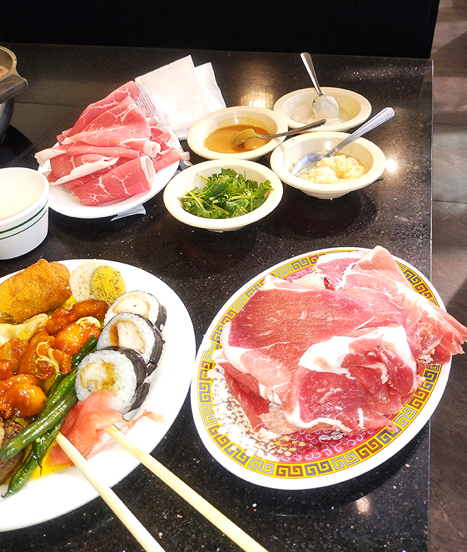 Hot pot heaven awaits the adventurous, with thinly sliced meats, fresh vegetables, and dipping sauces that transform your meal into an interactive experience.