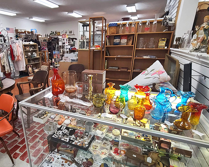 A kaleidoscope of colored glass catches the light, transforming ordinary shelves into a rainbow-hued museum of American domestic life.