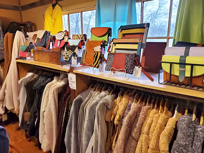 A rainbow of handcrafted bags perches above cozy jackets and sweaters. Perfect for those "it might get chilly later" mountain evenings we always forget about.