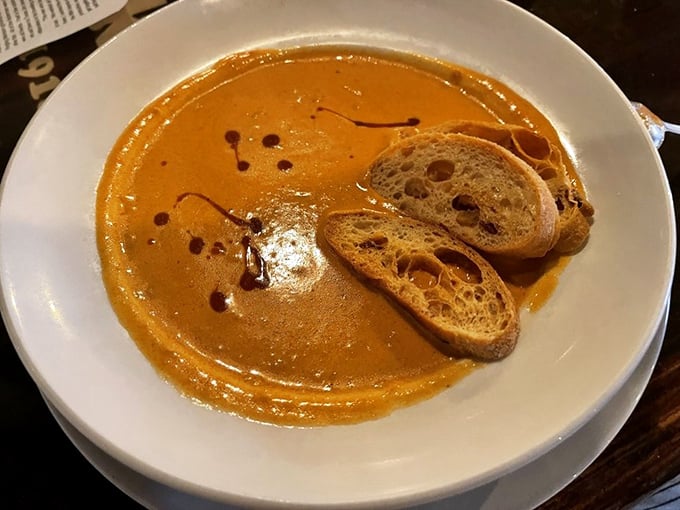 This lobster bisque isn't just soup &ndash; it's a warm, coral-hued embrace that whispers "everything's going to be alright" with each spoonful.