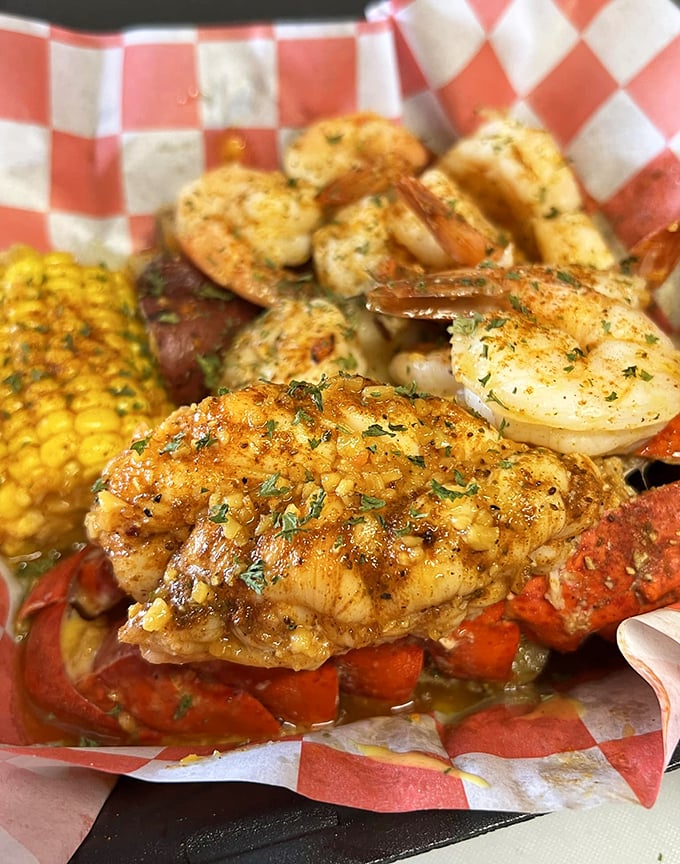 Butter-drenched lobster tail and plump shrimp lounging on a bed of corn. Not all heroes wear capes&mdash;some wear butter and seasoning.