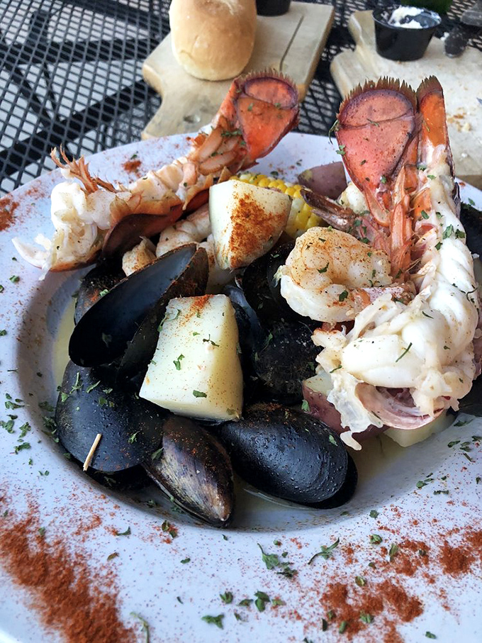 Ocean meets artistry in this seafood masterpiece. Those lobster tails aren't just dinner; they're the maritime equivalent of a standing ovation.