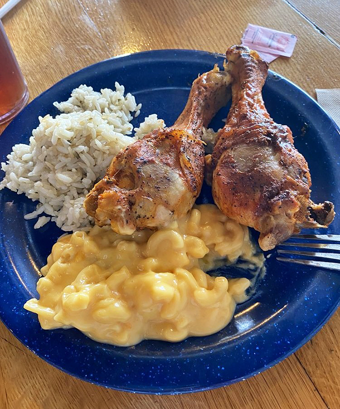 Fried chicken legs nestled against creamy mac and cheese&mdash;a plate that whispers "nap time" even as you're taking your first bite.