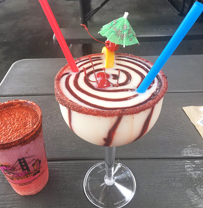 Their margaritas come dressed for a party, complete with tiny umbrellas. Like a beach vacation in a glass, minus the sunburn.