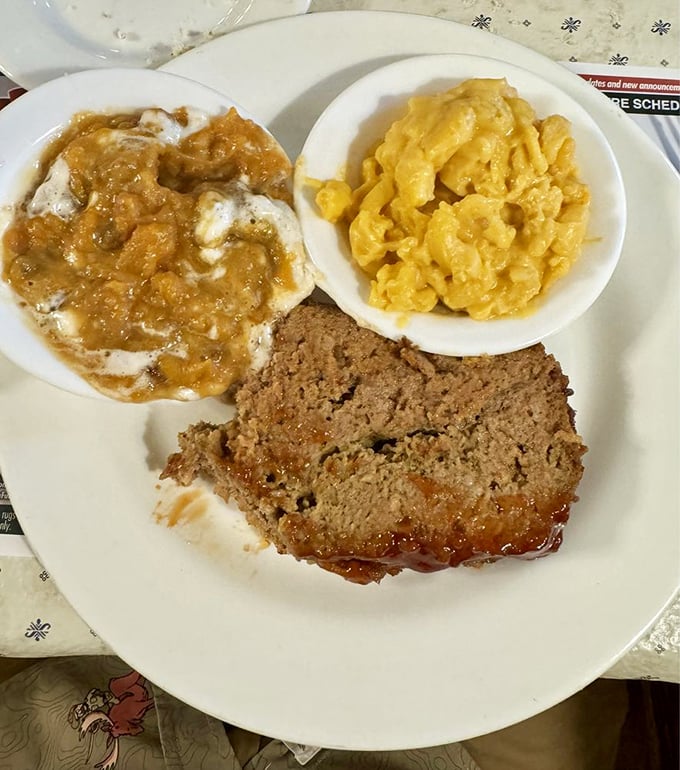 Meatloaf, mashed potatoes, and mac & cheese &ndash; the holy trinity of comfort food that makes you want to hug the chef.