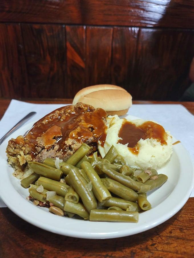 The legendary meatloaf arrives like a celebrity &ndash; flanked by green beans, mashed potatoes, and gravy that's practically auditioning for its own Food Network special.