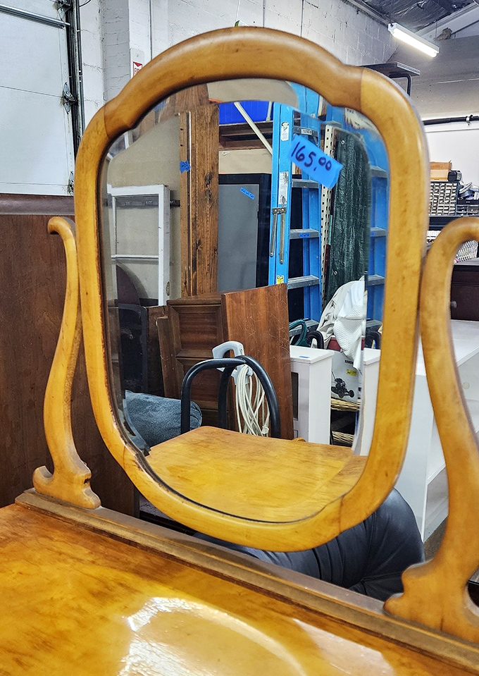 This isn't just a mirror&mdash;it's a time portal to when furniture was built with character. Reflect on that while admiring its curved wooden frame.