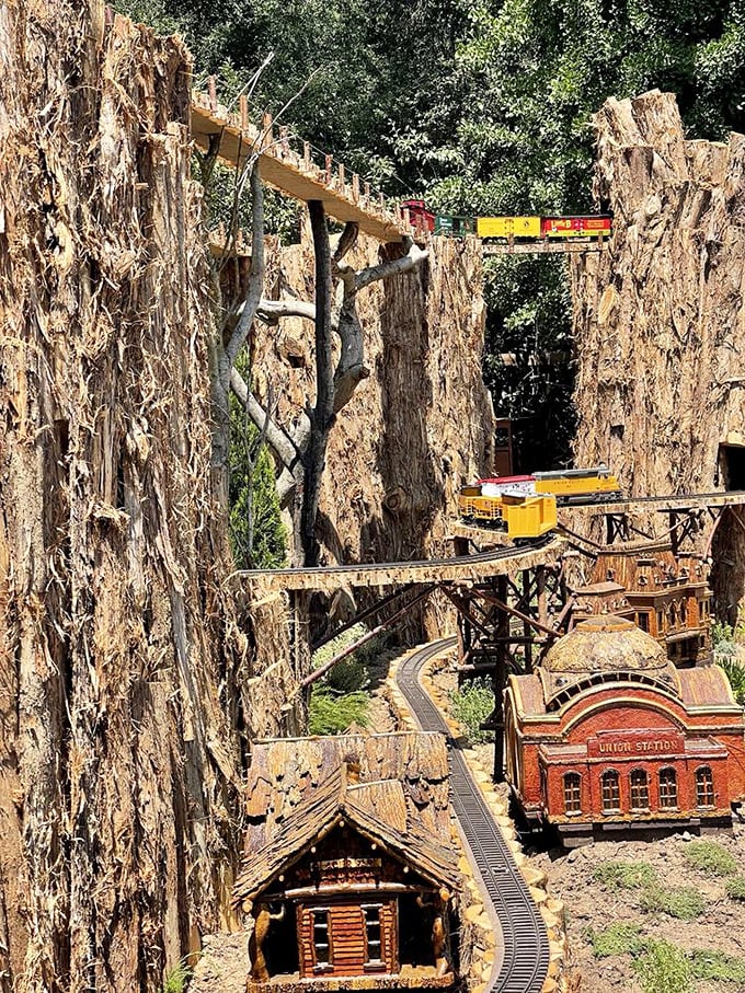 The Enchanted Railroad offers Gulliver-sized visitors a glimpse into a Lilliputian world where trains navigate through miniature mountains and tiny towns.