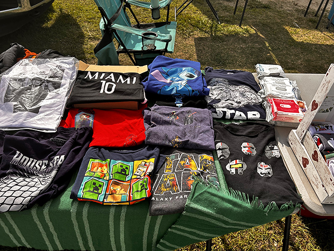 The unofficial uniform of flea market fashion&mdash;graphic tees displaying everything from Miami sports allegiance to Star Wars fandom.