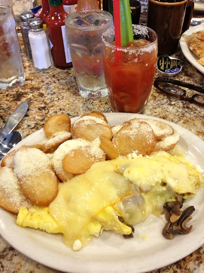 A cheese-blanketed omelet alongside perfectly round silver dollar pancakes &ndash; the breakfast equivalent of winning the lottery twice in one day.