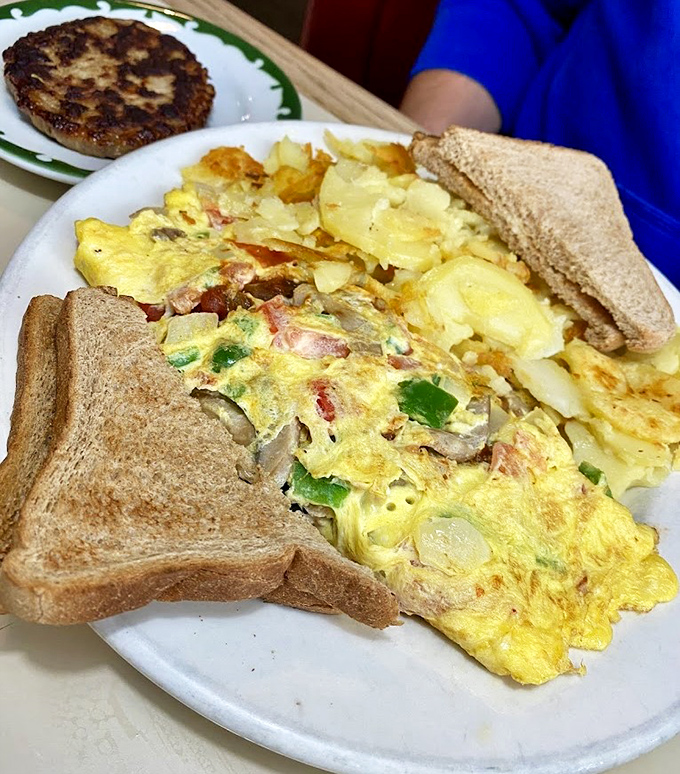 This isn't just an omelet&mdash;it's a masterclass in breakfast architecture, with perfectly distributed fillings and that golden exterior that says "good morning" better than words.