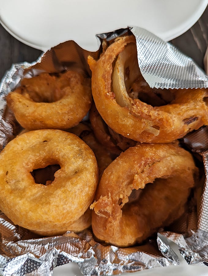 These aren't your average onion rings&mdash;they're golden halos of happiness, crispy enough to make angels weep with joy.