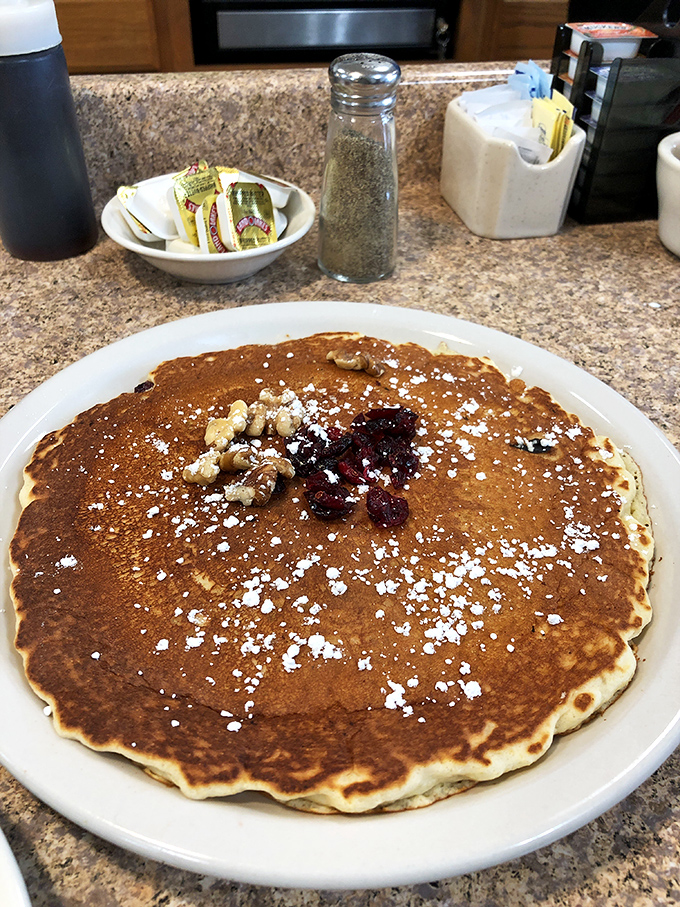 This pancake isn't just golden brown&mdash;it's the breakfast equivalent of winning the lottery, complete with berry and walnut jackpot.