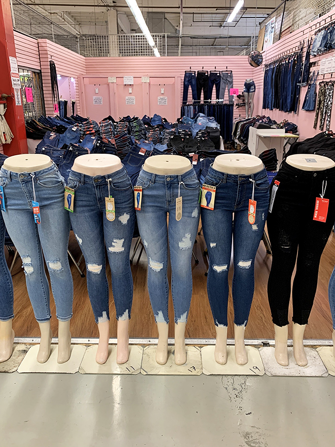 Denim heaven awaits in this pink-walled boutique. These distressed jeans aren't just pants—they're fashion statements waiting for the right person to make them sing.