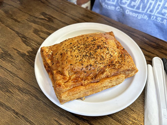 This herb-topped savory pastry isn't just lunch; it's edible geometry with corners of perfection that would make your high school math teacher weep with joy.