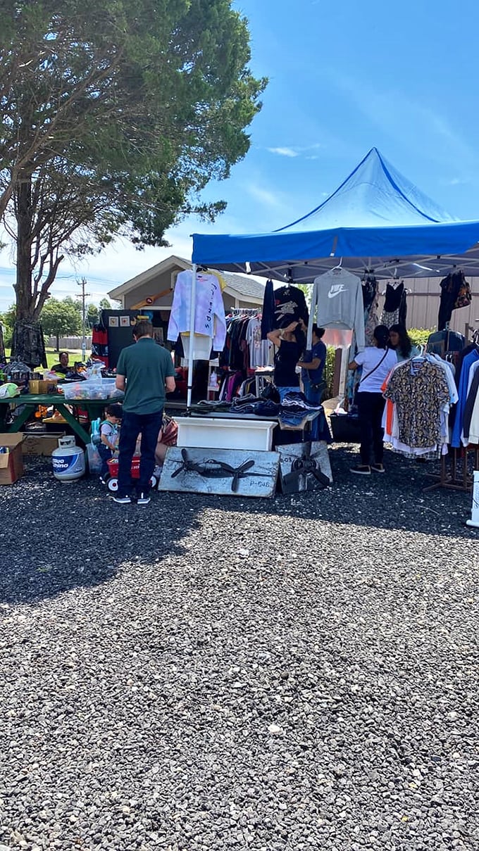 The market's true treasures aren't just the finds—they're the people. These vendors sharing a moment with a gift basket embody the community spirit that keeps shoppers coming back.