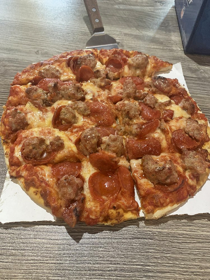 The marriage of pepperoni and sausage on this pie isn't just a topping combination &ndash; it's a flavor partnership worthy of relationship goals.